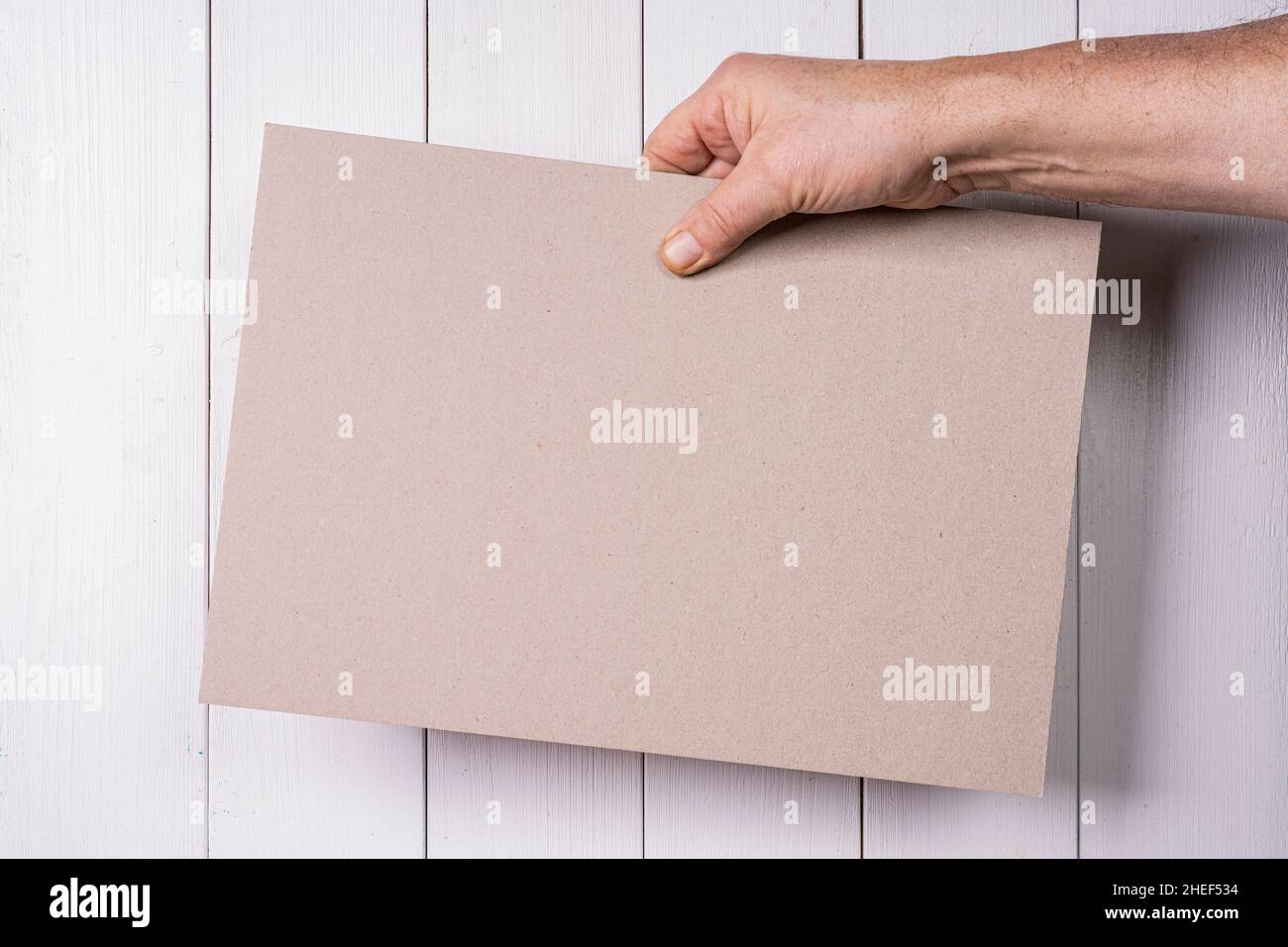a cardboard sign held in hand Stock Photo - Alamy