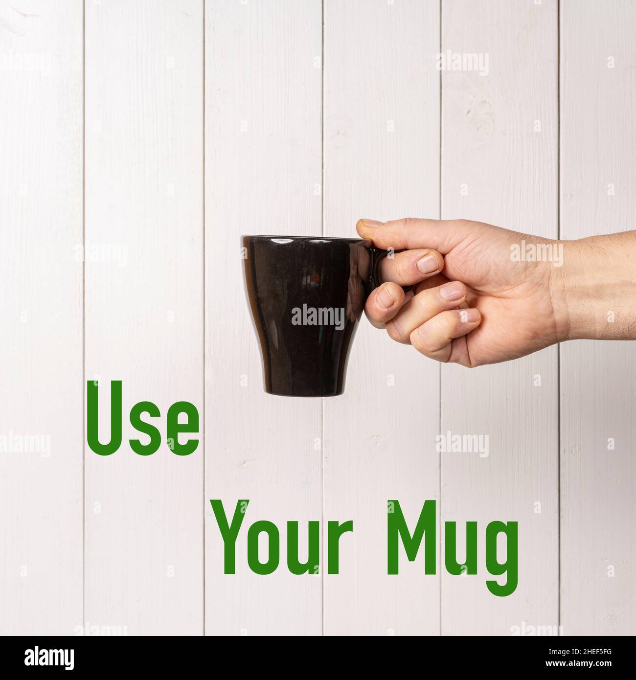 a cup of coffee and an invitation to use reusable cups Stock Photo - Alamy