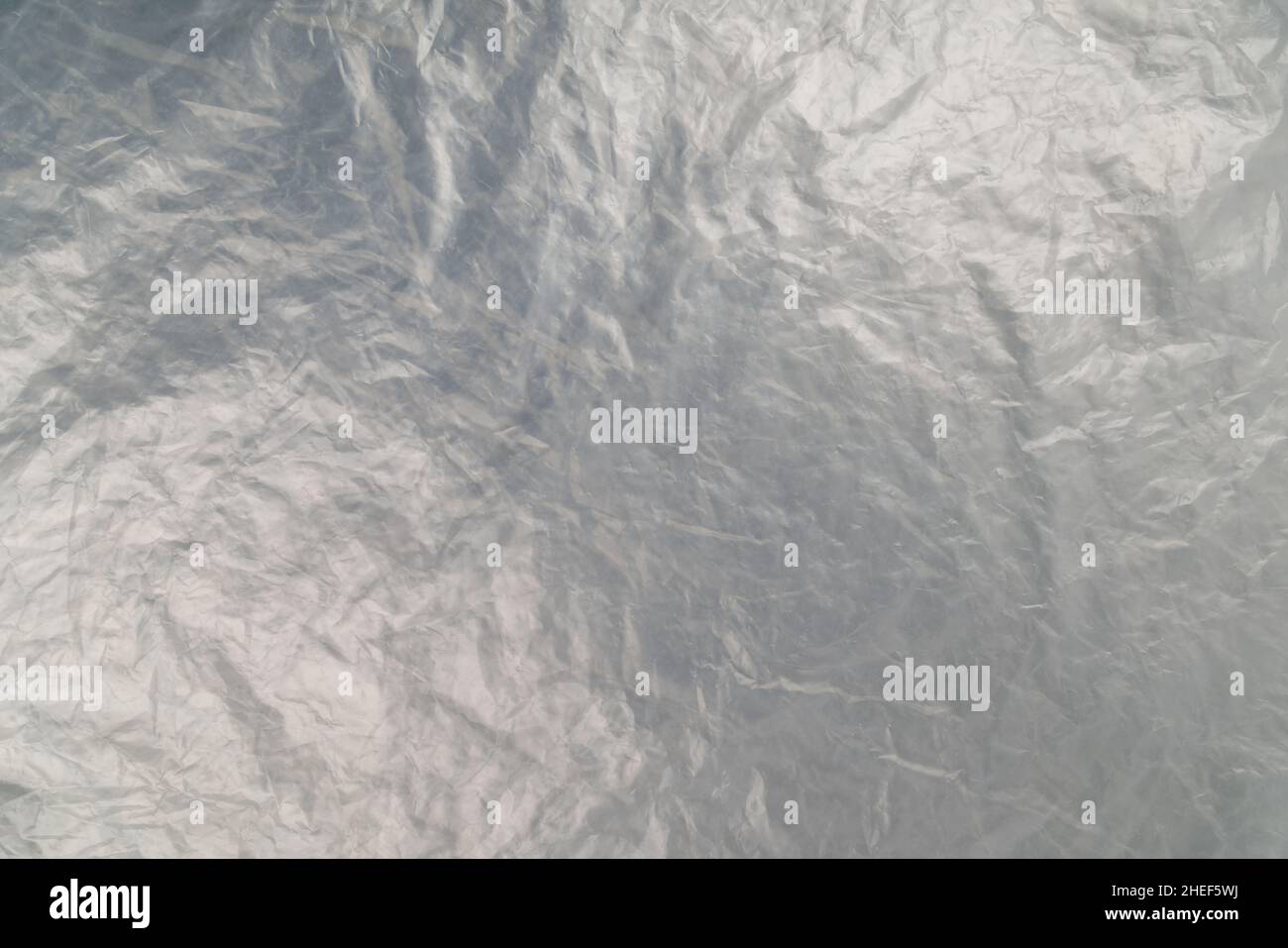 full frame background of flat crumpled semi-transparent polyethylene ...