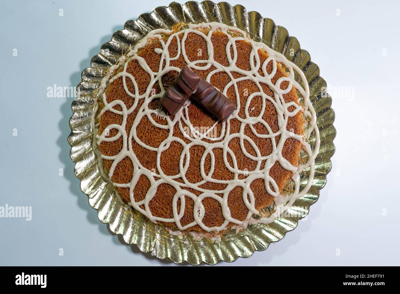 Arabic traditional dessert - kunafa - konafa in a tray with pistachio ...