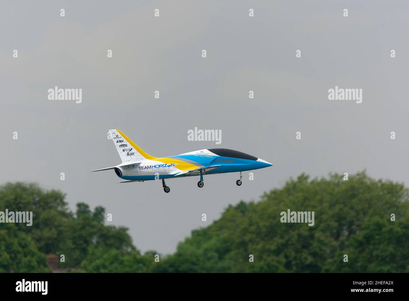 Model airplane in flight in the sky Stock Photo - Alamy