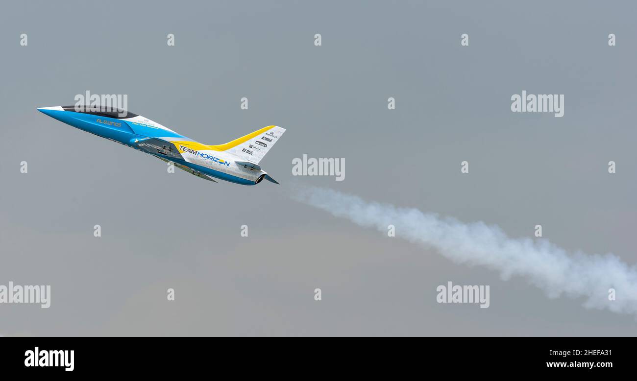 Model airplane in flight in the sky with smoke trail Stock Photo - Alamy
