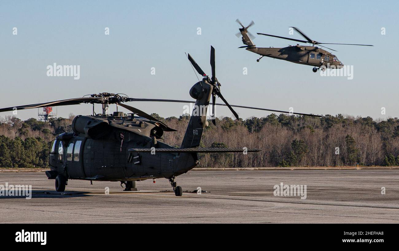 A U.S. Army UH-60 Black Hawk Helicopter takes off from the runway at ...