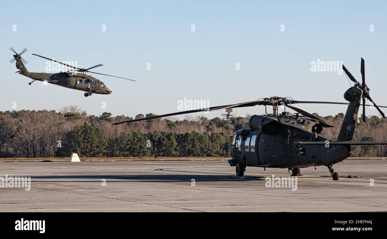 A U.S. Army UH-60 Black Hawk Helicopter takes off from the runway at ...