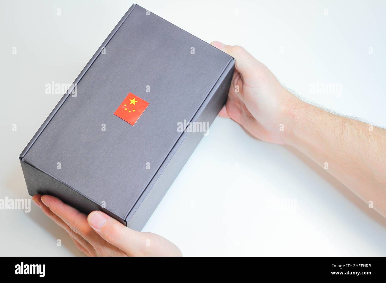 Post from China. Receiving a parcel. Box with the Chinese flag Stock ...