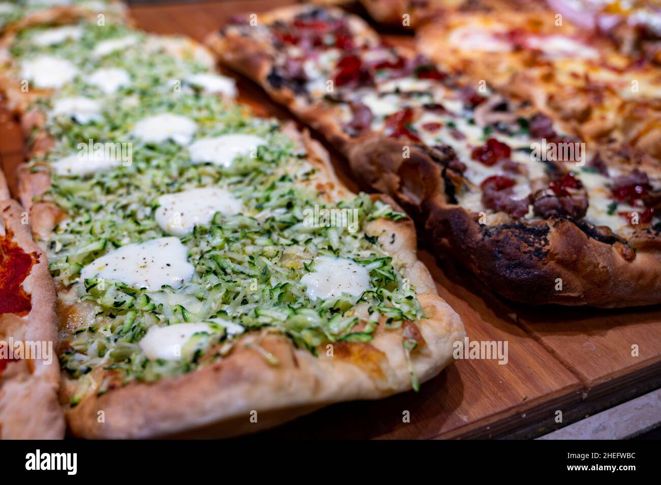 Fresh baked focaccia or pala romana pizza with vegetables and cheese in ...