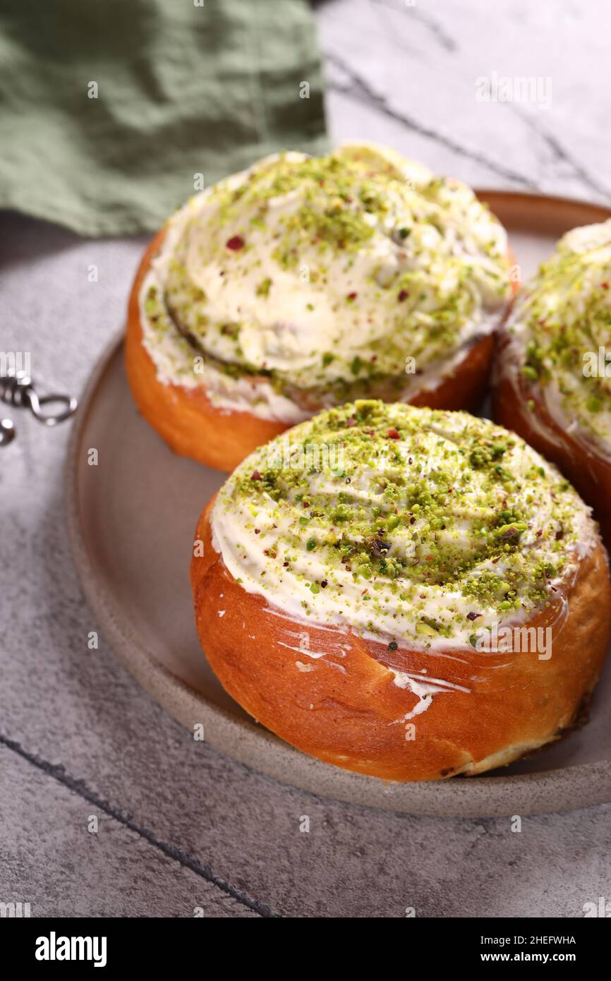 traditional cinnamon buns with icing Stock Photo - Alamy
