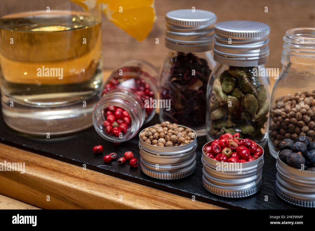 Professional set of gin spices in small bottles, pink pepper, hibiscus ...