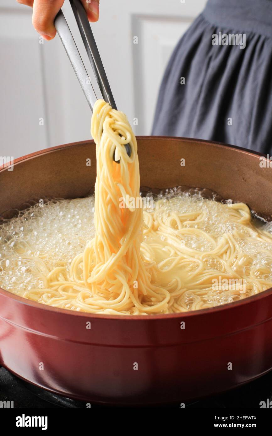 Asian Female Hand Boiled Asian Noodle (Mie Telur or bakmi), Cooking ...