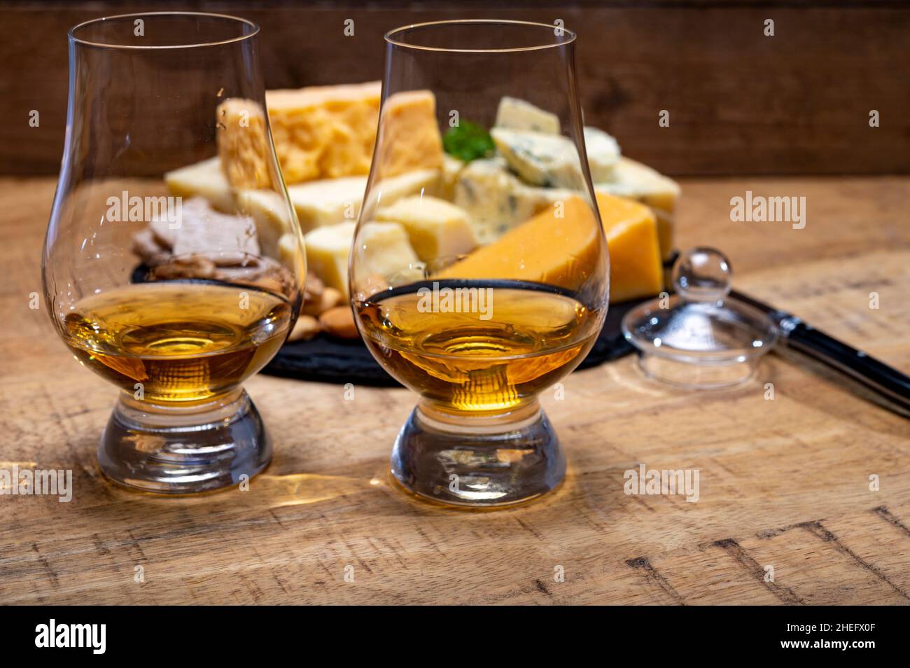 British drinks and food pairing, glasses of Scotch whisky and cheeses ...