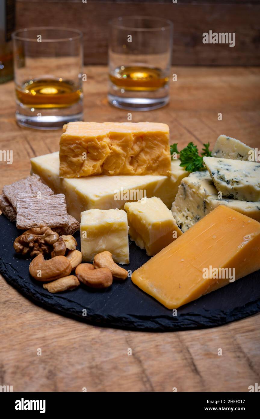 British drinks and food pairing, glasses of Scotch whisky and cheeses ...