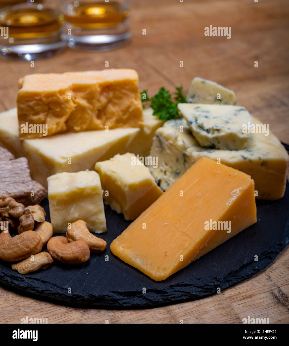British drinks and food pairing, glasses of Scotch whisky and cheeses ...