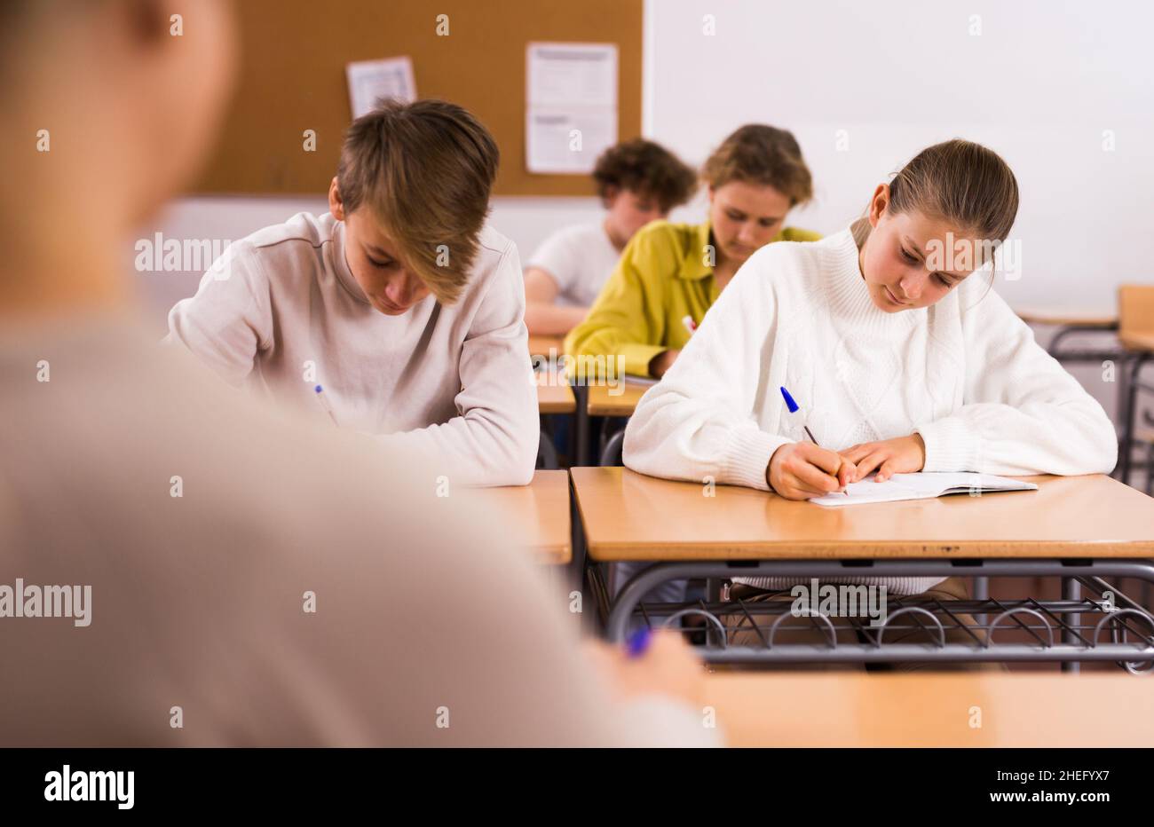 Teenager boy and girl studying in classroom Stock Photo - Alamy
