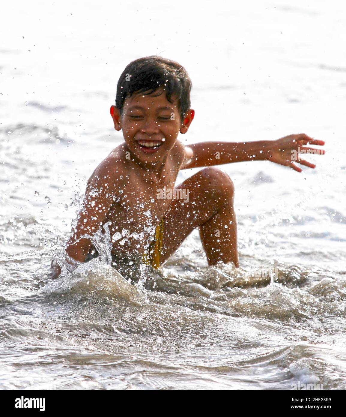 Asian kids playing on a beach hi-res stock photography and images - Alamy