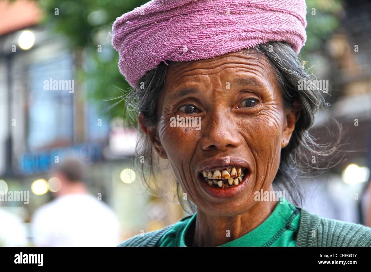 An elderly Balinese knife seller in Kuta on the island of Bali in ...