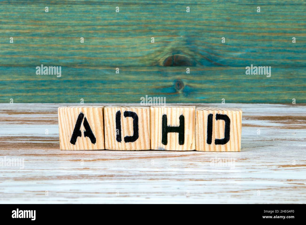 ADHD Attention Deficit Hyperactivity Disorder. Text on a wooden ...