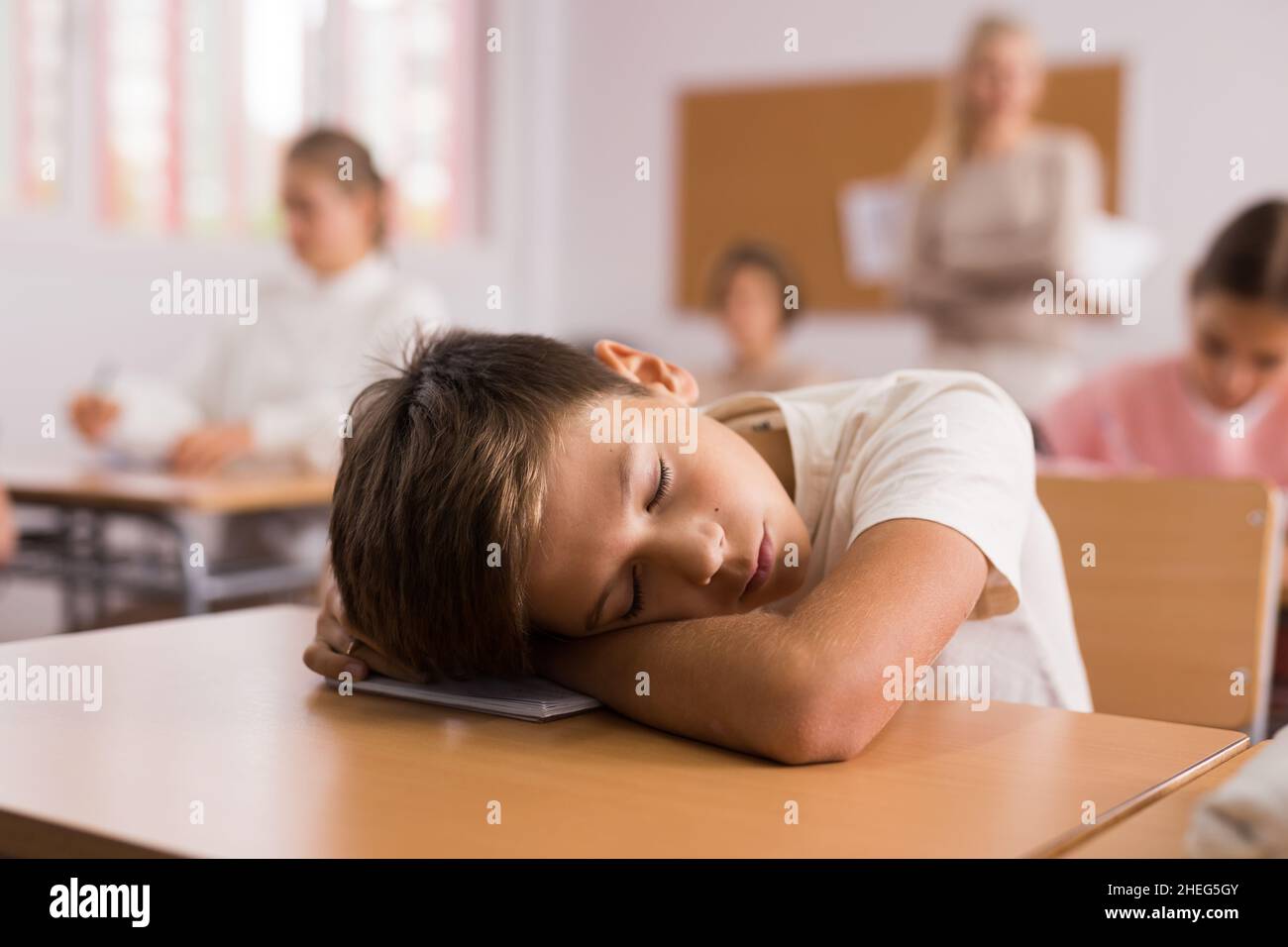 Tired bored teenage schoolboy sleeping Stock Photo - Alamy