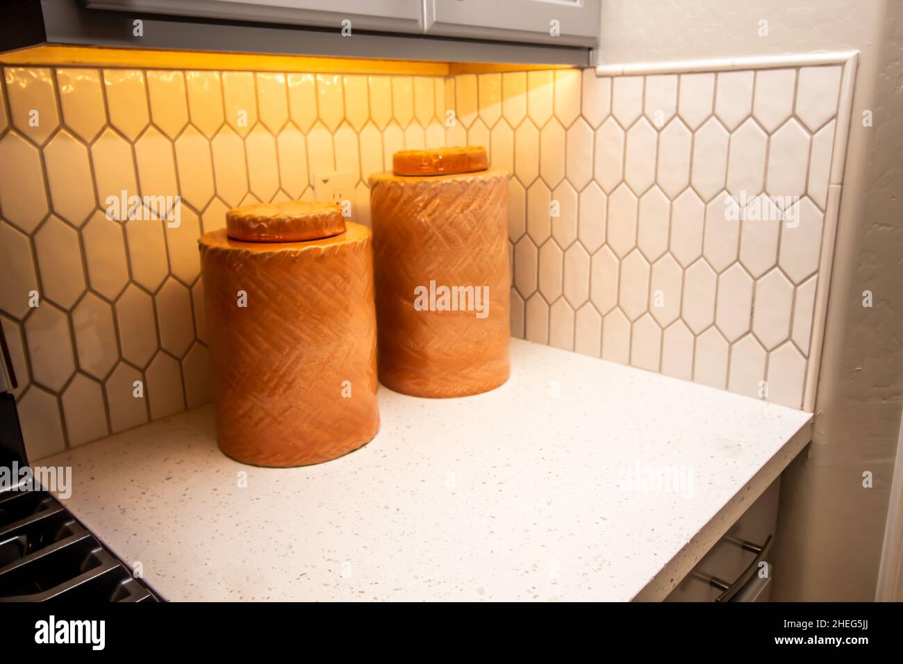 Two Ceramic Containers With Lids On Kitchen Counter Top Stock Photo - Alamy