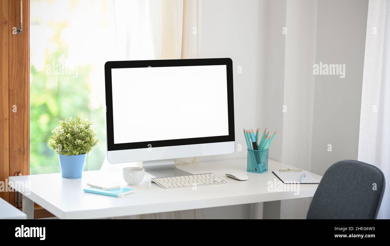 A modern minimal bright workspace with desktop pc computer white screen ...