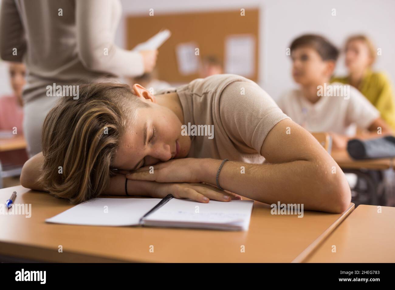 Tired bored teenage schoolboy sleeping Stock Photo - Alamy