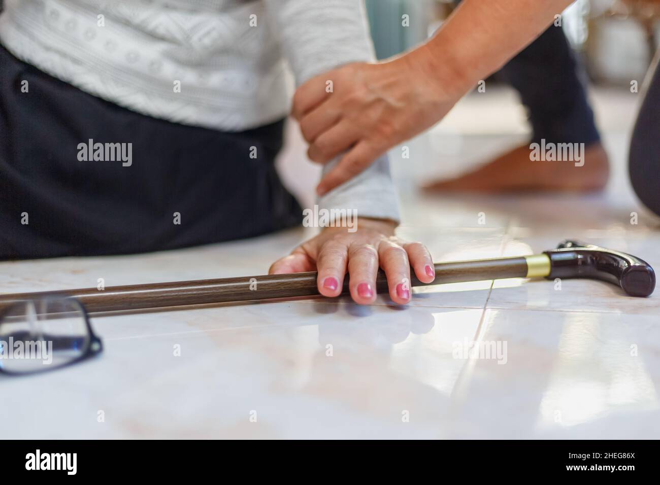 Senior woman falling down at home because stumbled on a door kerb Stock ...