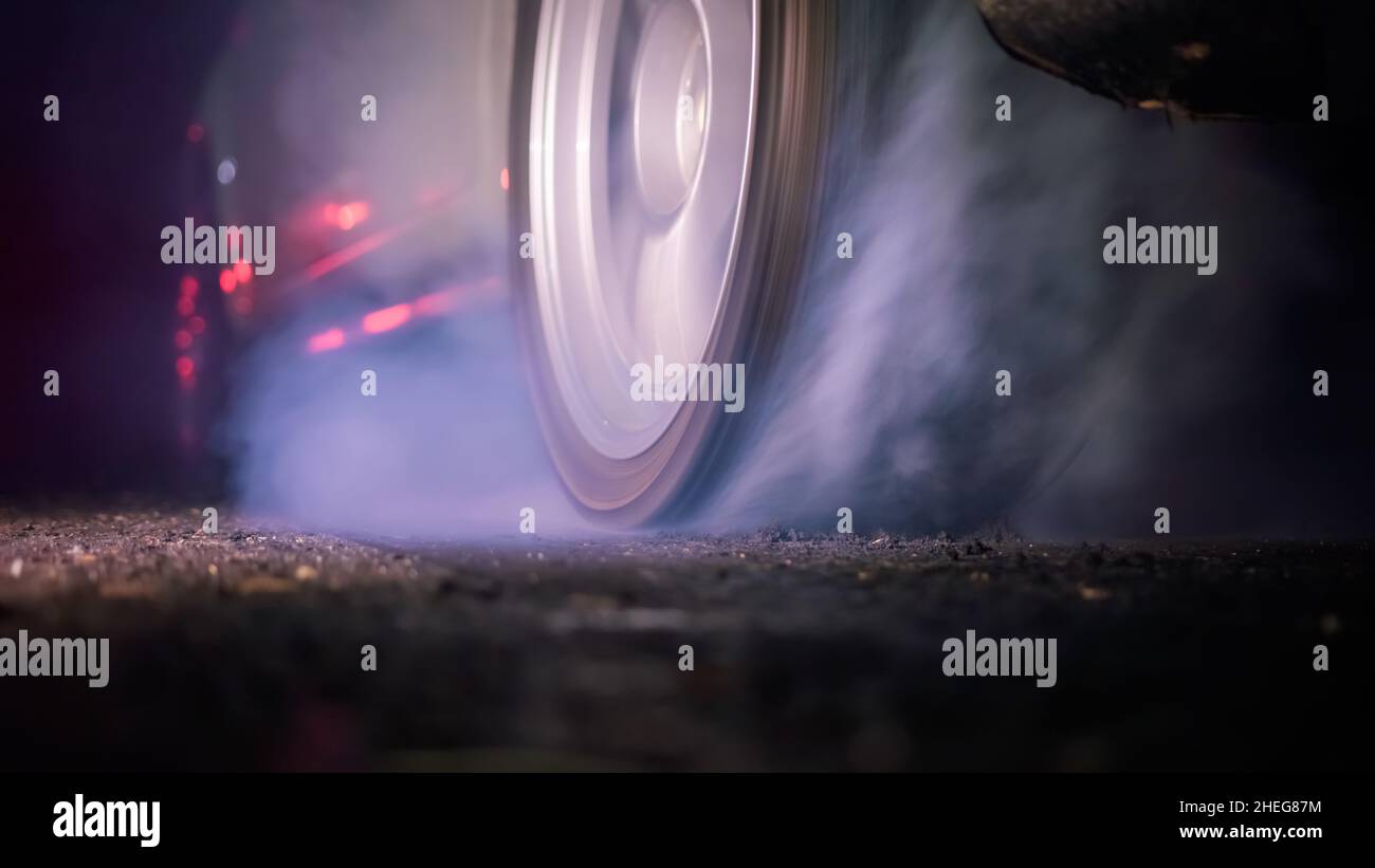 Drag racing car burning tire at starting line in race track Stock Photo ...
