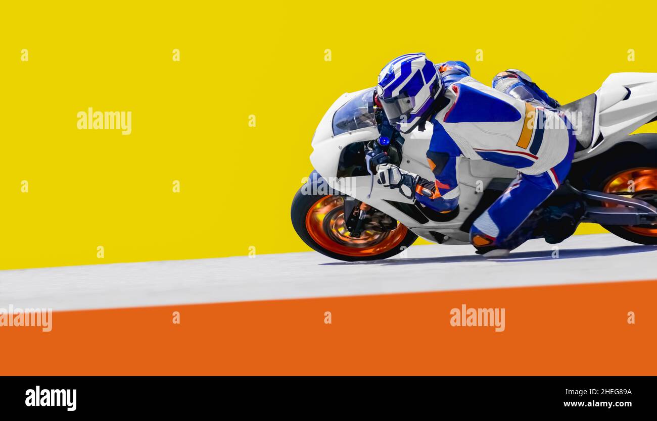 Motorcycle leaning into a fast corner on race track Stock Photo - Alamy