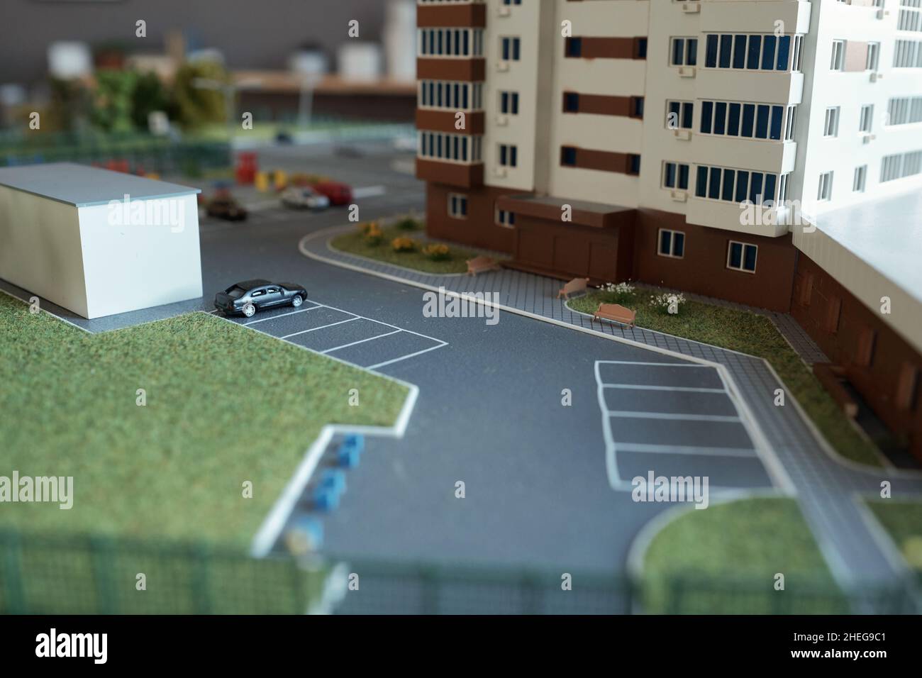 Part of architectural layout with asphalted road, built house, cars ...