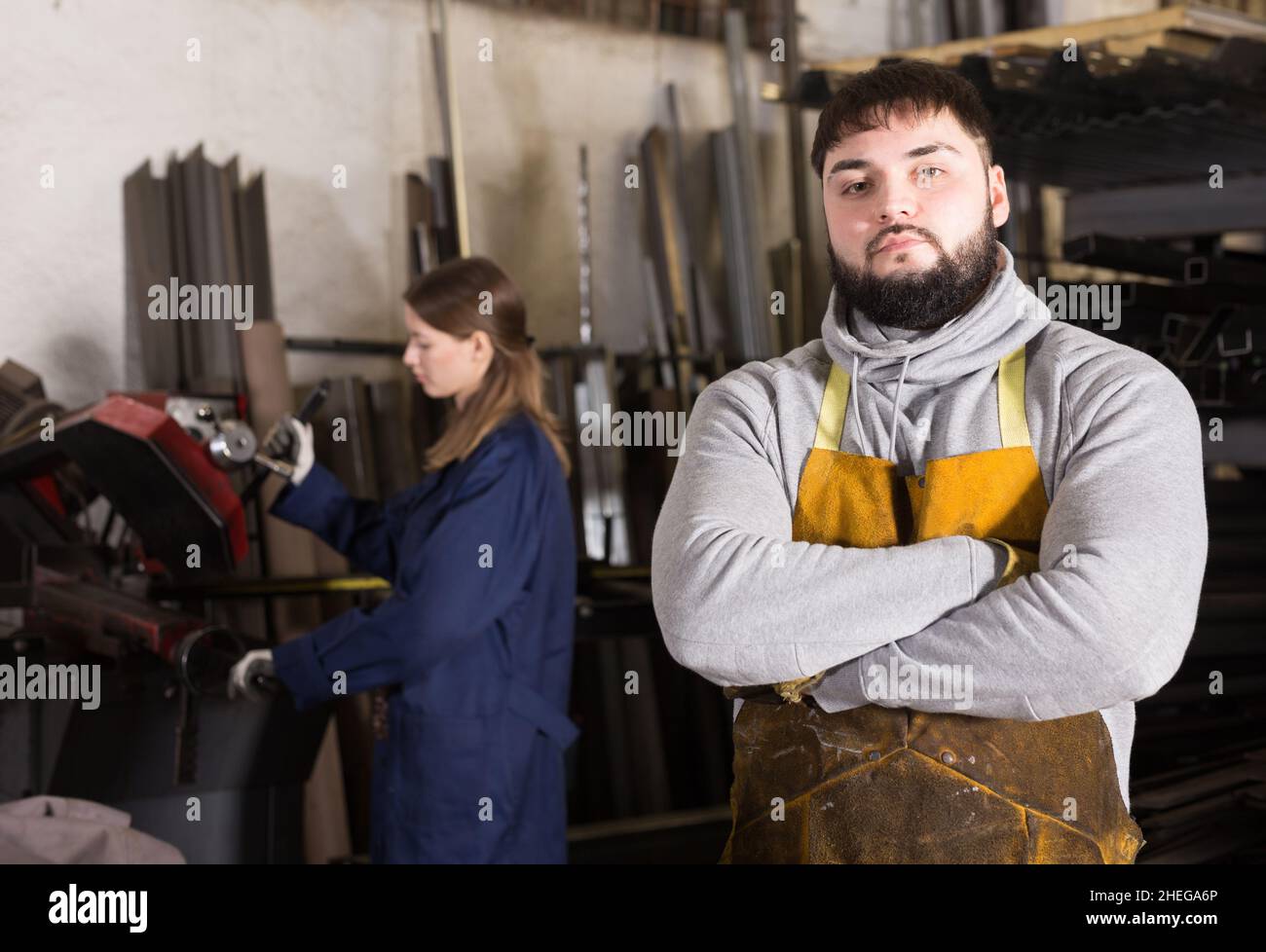 Blacksmith in metalworking workshop Stock Photo - Alamy