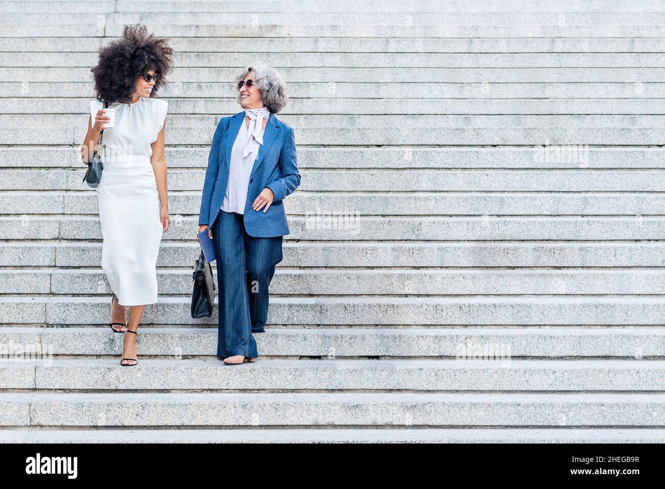 employee and her manager coming home from work Stock Photo - Alamy