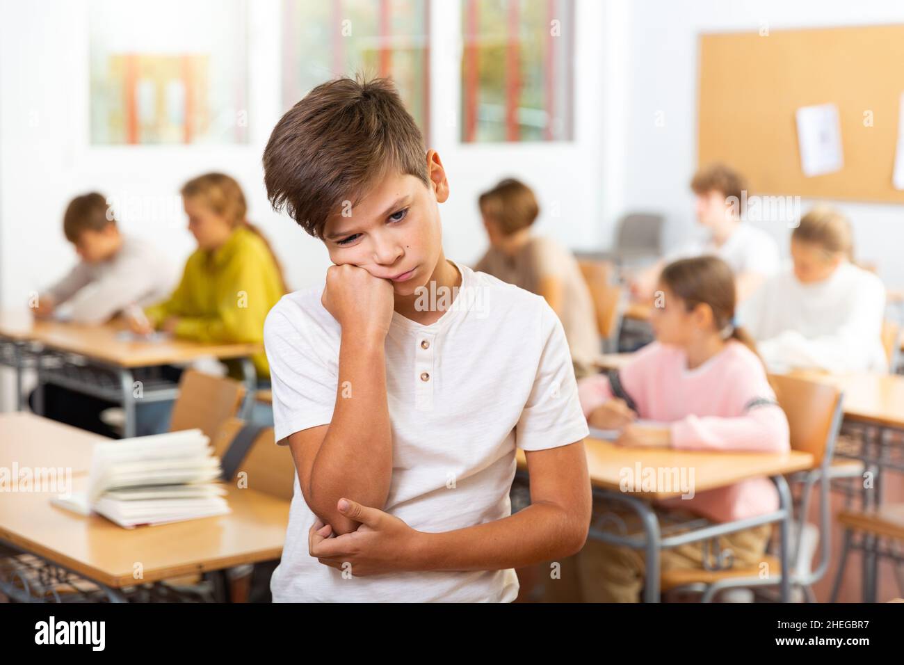 Boy feeling upset after getting bad mark at school Stock Photo - Alamy