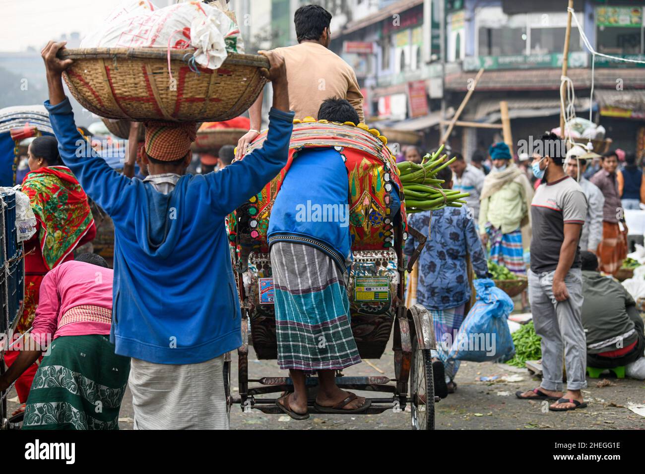 General view of the bustling activity at Kawran Bazaar vegetable market ...
