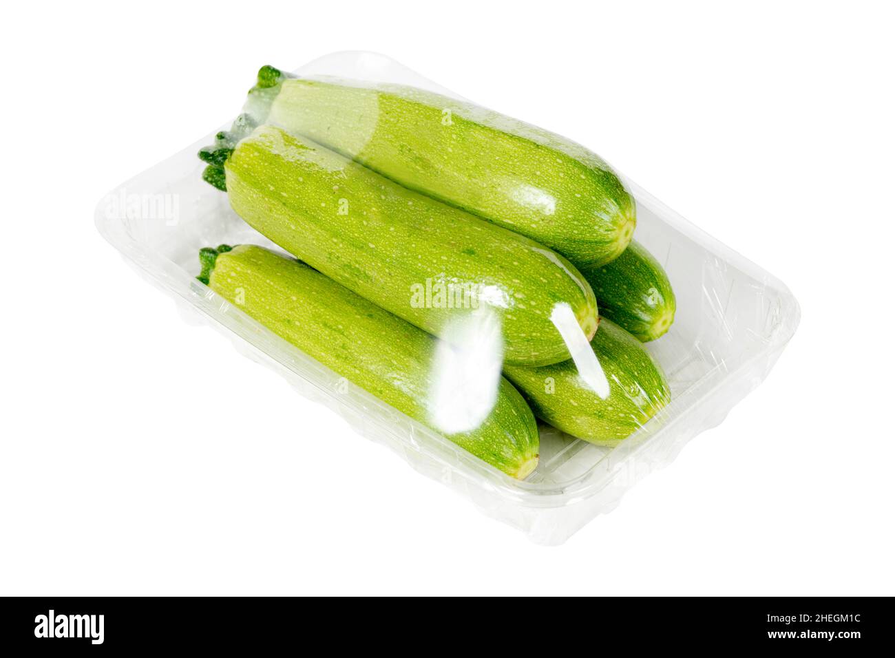 Packaged and labeled fresh zucchini on isolated white background Stock ...