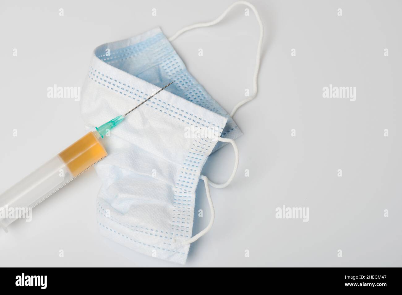 Medical equipment on white background close up view. Syringe and face ...