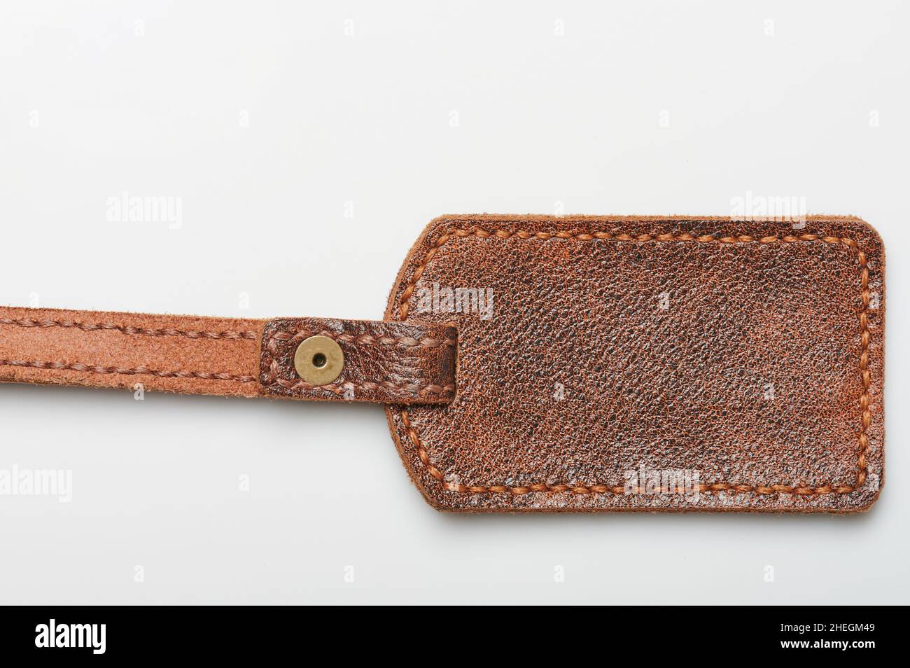 Brown leather tag isolated on white studio background Stock Photo - Alamy
