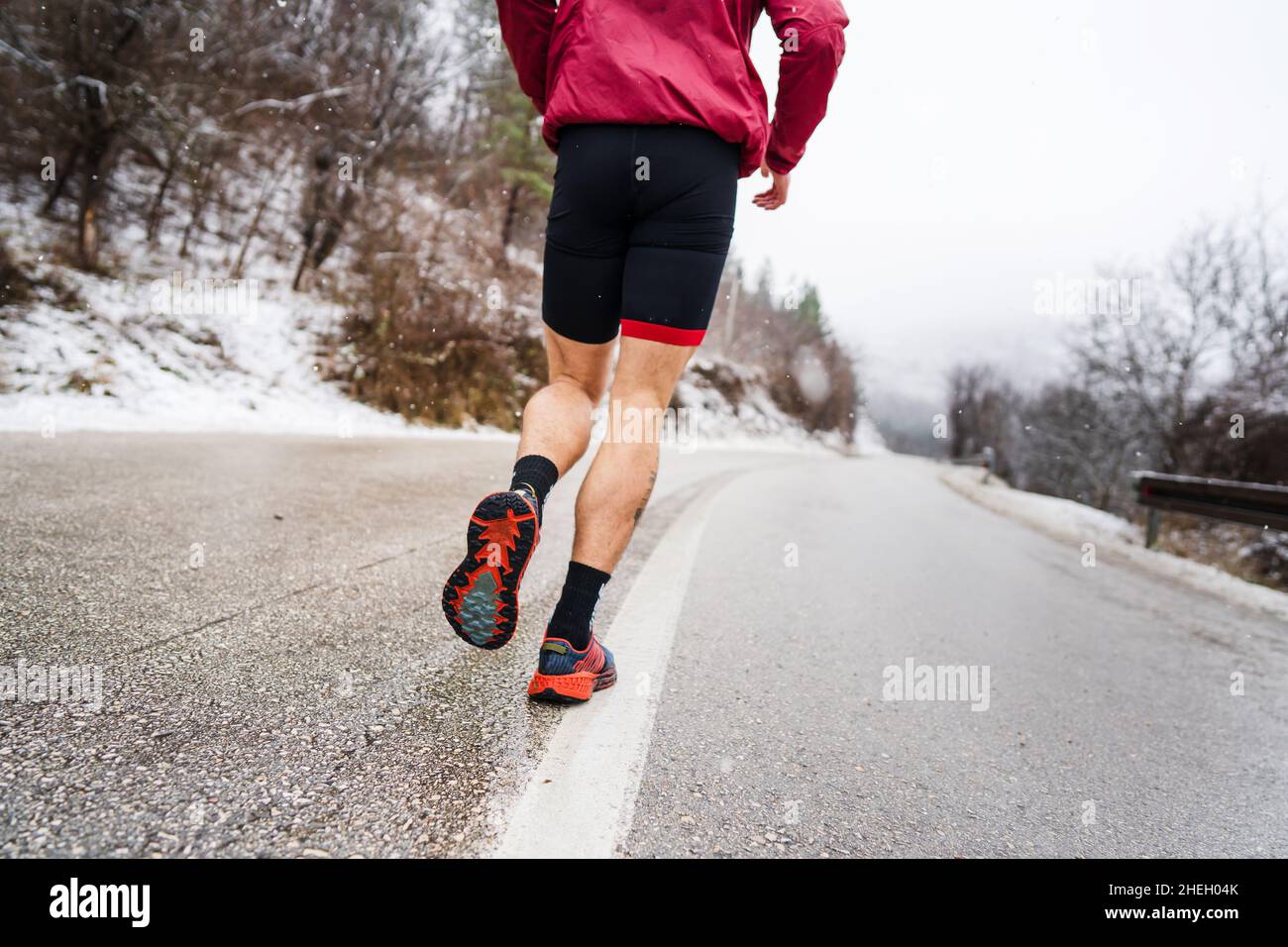 One adult caucasian man running in winter day male athlete runner ...