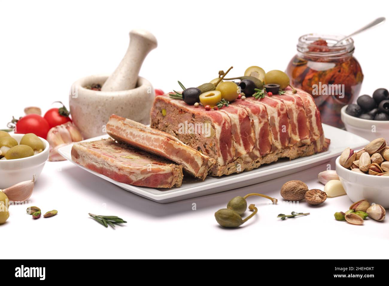 Traditional French terrine covered with bacon isolated on white ...