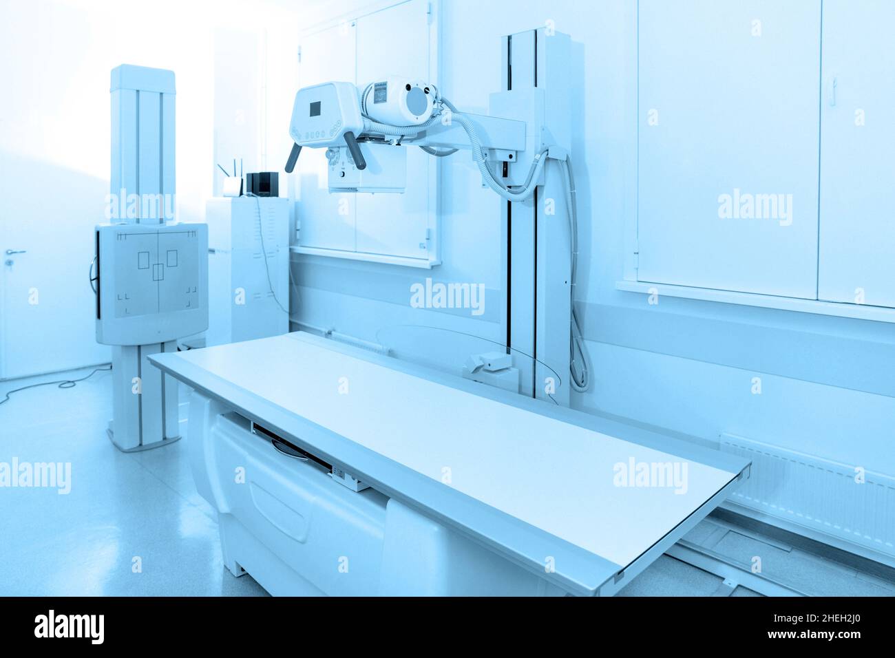 X-ray department in modern hospital. Radiology room with scan machine ...
