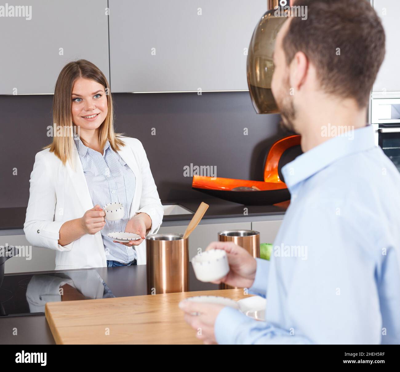 Woman drinking tea with boyfriend Stock Photo - Alamy