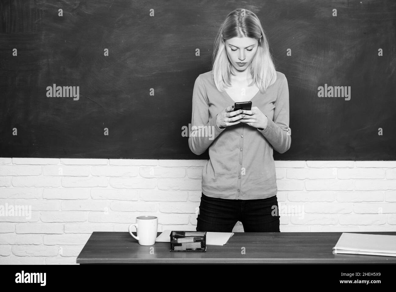 Woman student study with modern smartphone gadget. College education ...
