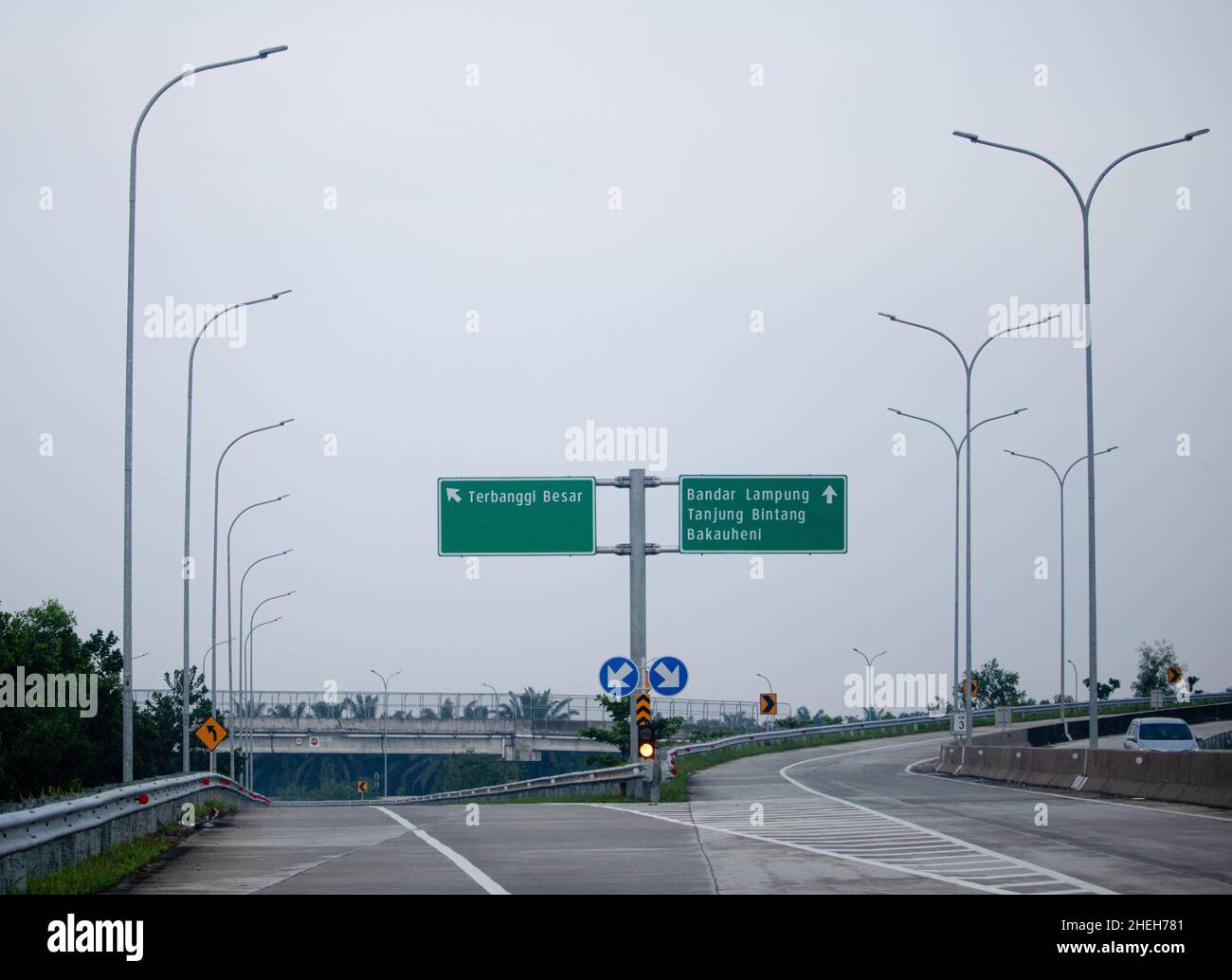 Lampung - December 28, 2021. Road signs at the intersection of the toll ...