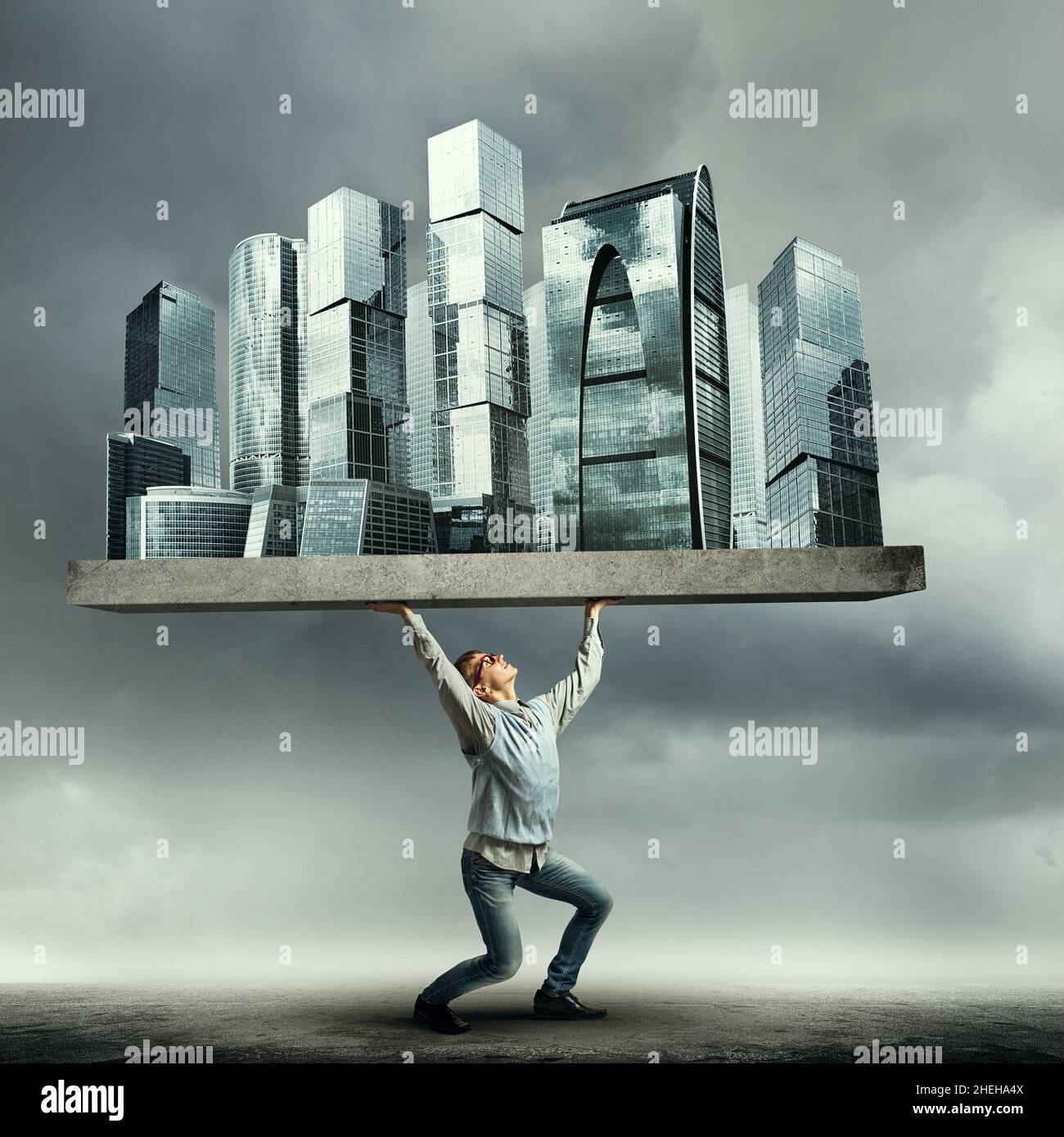 Guy lifting cement banner Stock Photo - Alamy