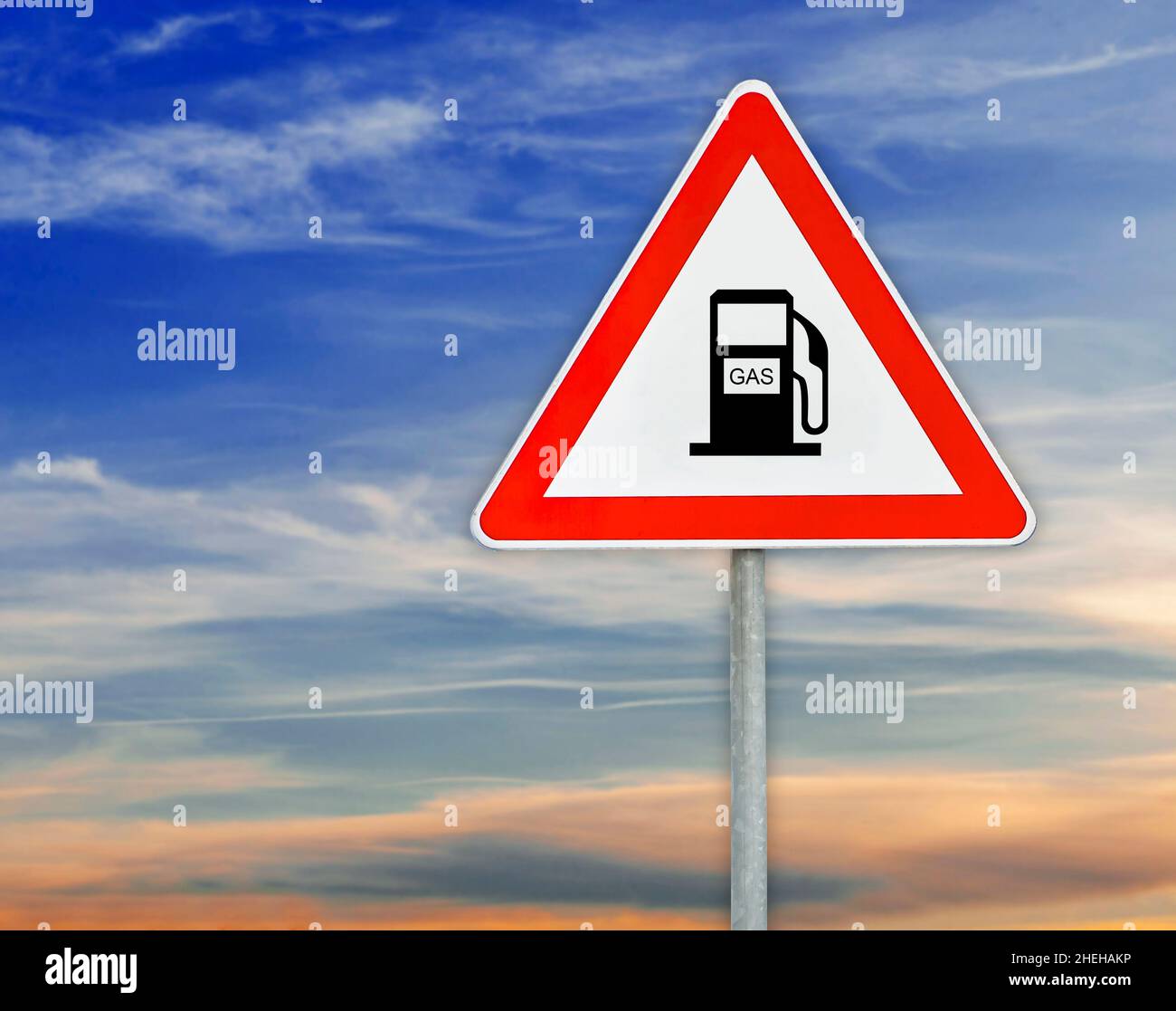 Triangle road sign gas pump Stock Photo - Alamy