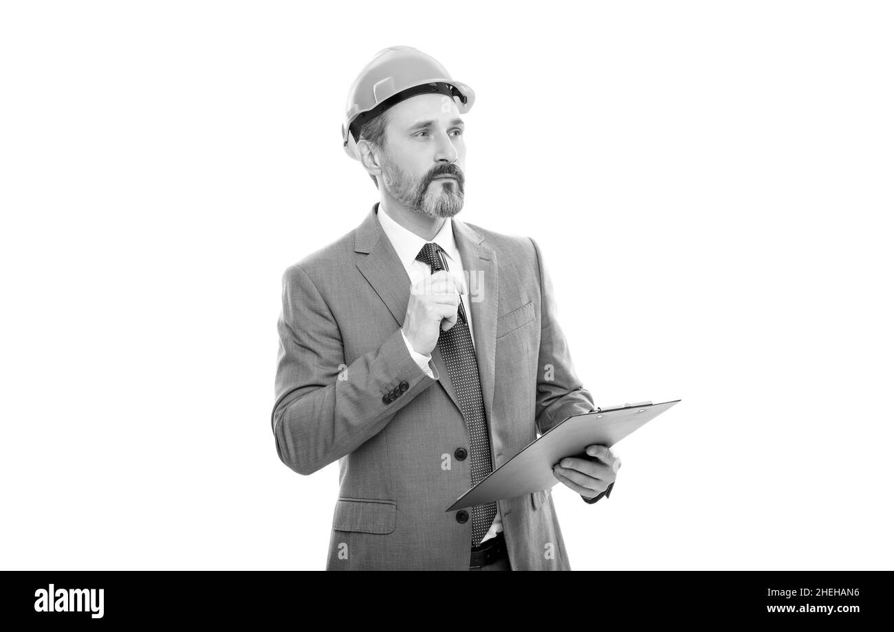 successful man in hardhat making notes. entrepreneur read project. ceo ...