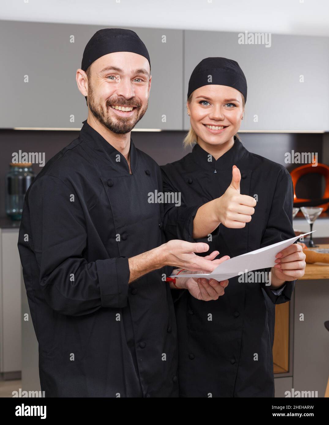 Chefs discussing menu Stock Photo - Alamy