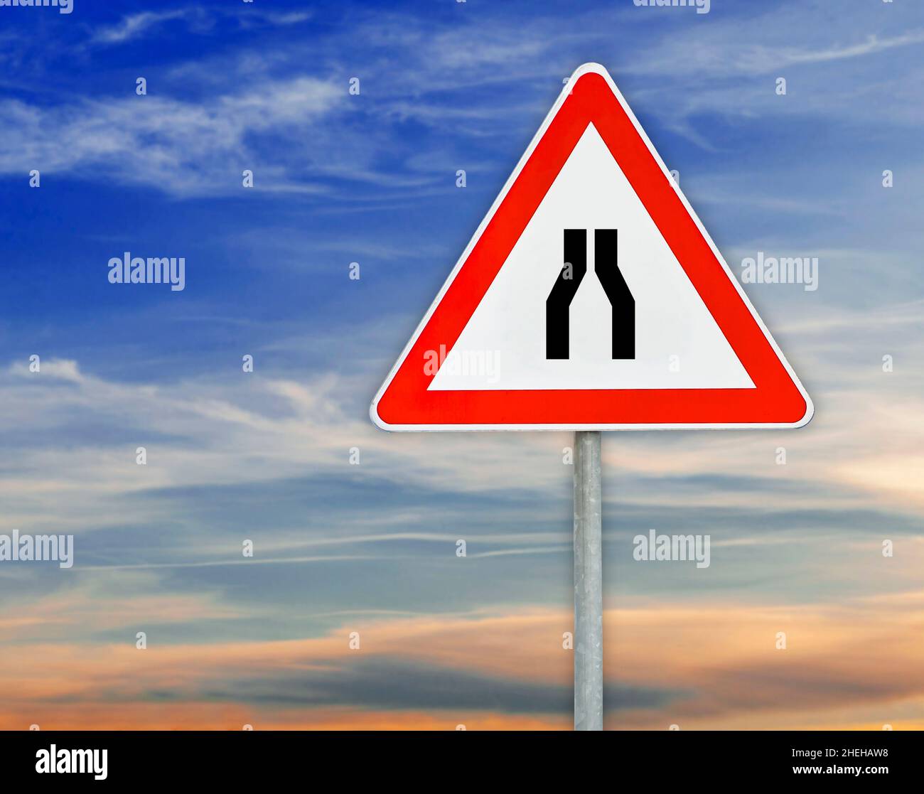 Triangle road sign with direction Stock Photo - Alamy