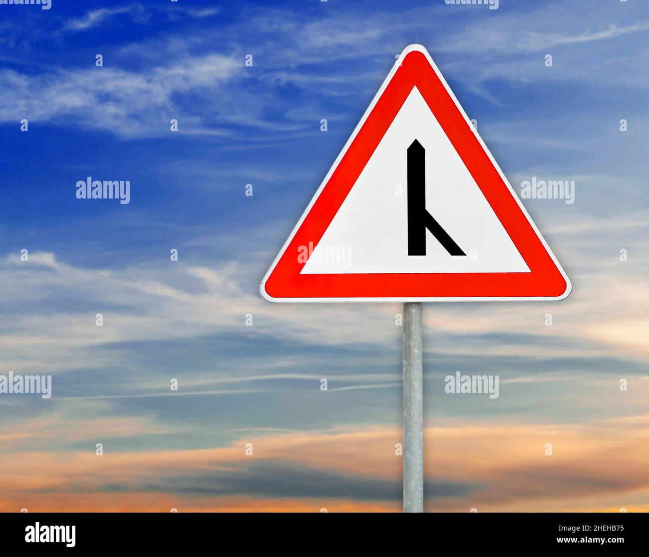 Triangle road sign with direction Stock Photo - Alamy