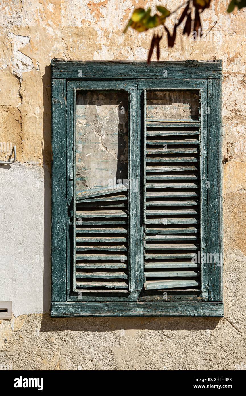 old green weathered wooden window frame with some slats missing Stock ...