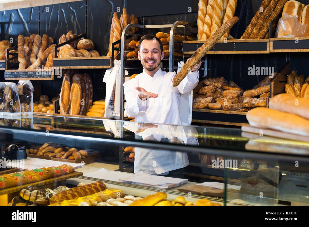 Young man selling loaf bread hi-res stock photography and images - Alamy
