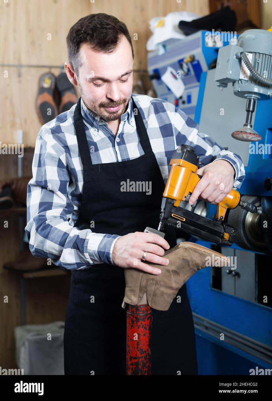 Smiling male professional worker using instruments Stock Photo - Alamy